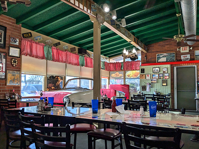 Red curtains, yellow tables, and that signature green ceiling&mdash;dining here feels like being inside a Norman Rockwell painting with better food.