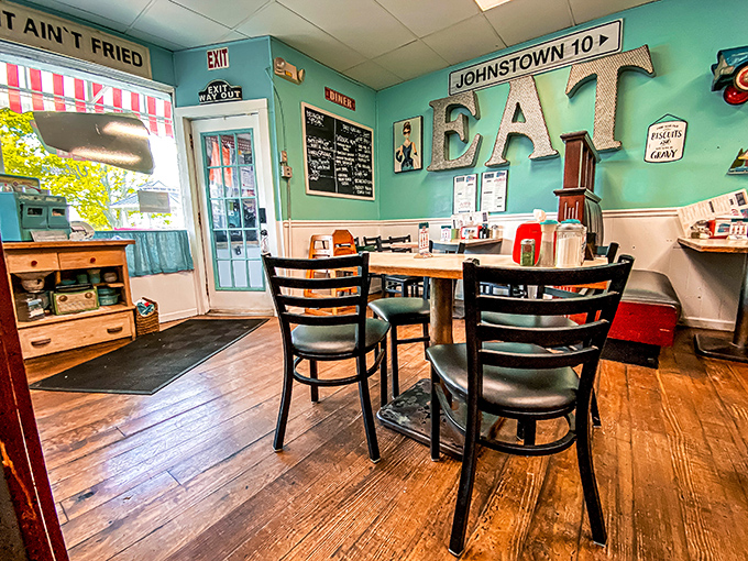 The "EAT" sign isn't just decoration&mdash;it's the simplest, most honest command you'll happily obey in this cozy corner of the diner.