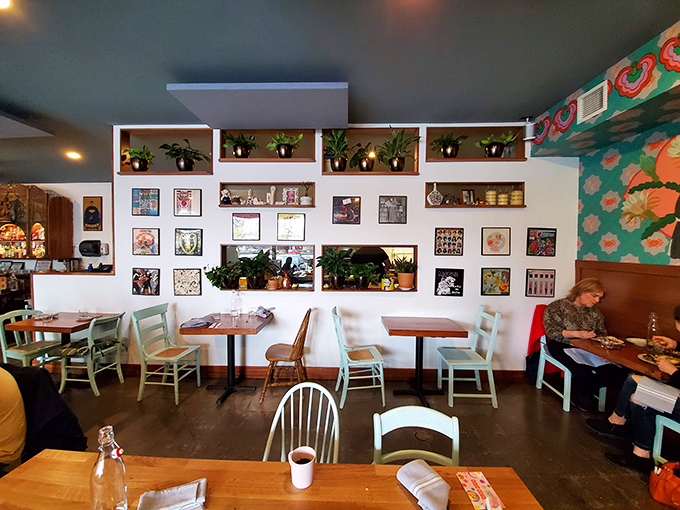 Plants, patterns, and perfectly spaced tables create a dining room where every seat feels like the best in the house.