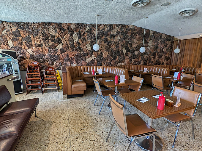 The stone wall and caramel-colored booths create a retro sanctuary where calories don't count and coffee refills are practically mandatory.