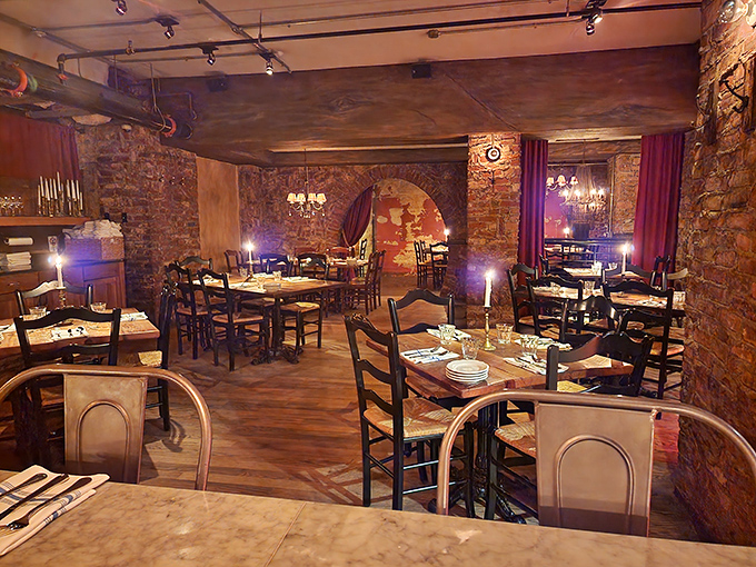 Candlelit tables nestled between exposed brick walls create an atmosphere that whispers "stay awhile." Romance practically comes with the bread service here.