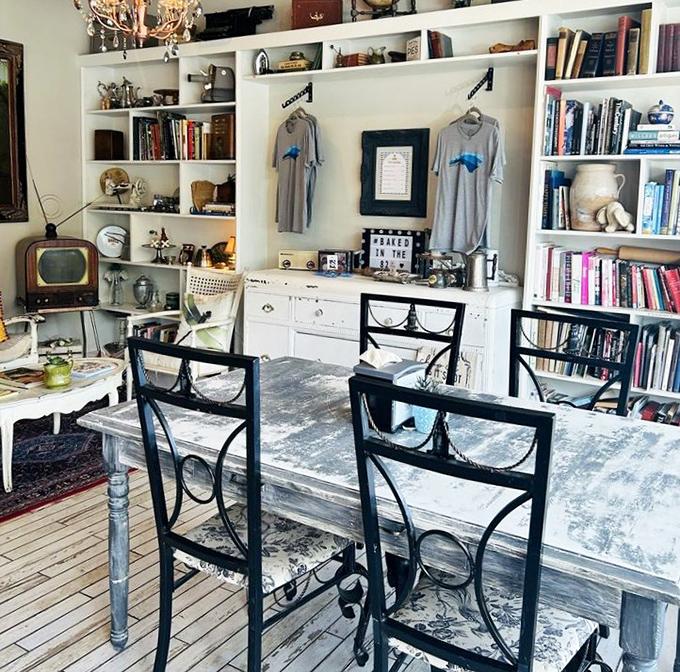Vintage treasures and white bookshelves create a space that's part library, part dining room, all charm. Even the chairs look like they have stories to tell.