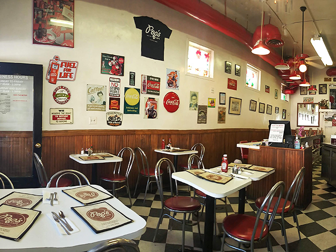 The dining area speaks volumes without saying a word&mdash;vintage signs, red accents, and tables that have hosted thousands of morning conversations.