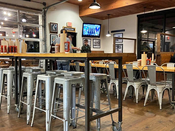 Metal stools, wooden tables, and garage doors that open to let the barbecue aroma waft into the neighborhood like a siren call.