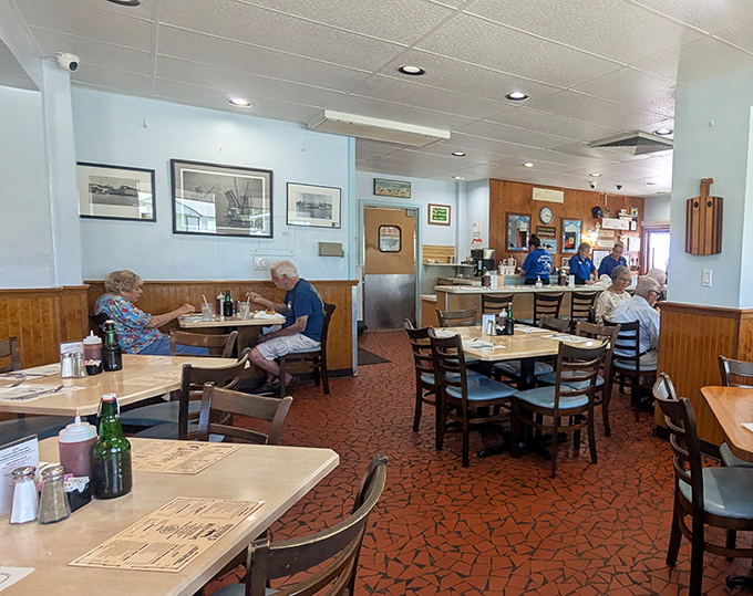 A dining room where memories are made. Simple tables, comfortable chairs, and the promise of seafood excellence bring people together.