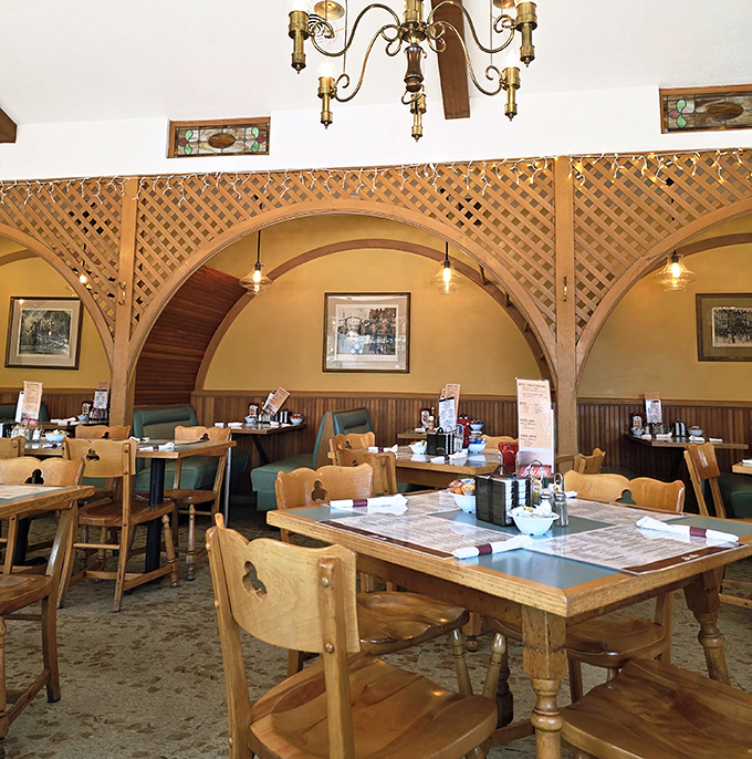 The dining area's wooden arches create little sanctuaries for enjoying your meal, like breakfast booths designed by someone who understood food is theater.