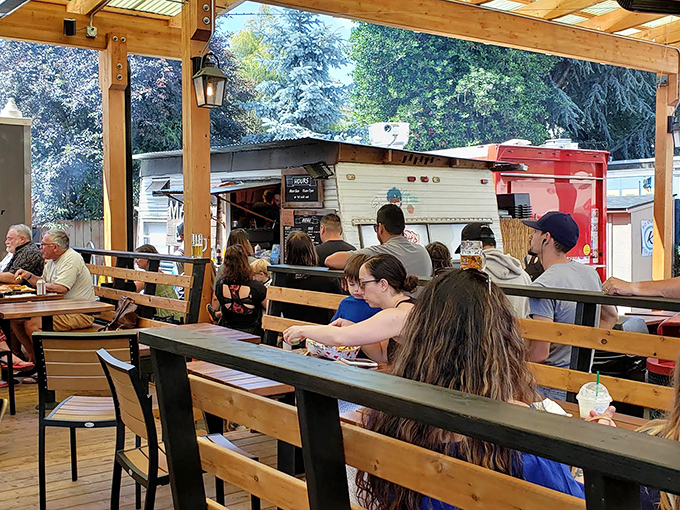 The covered dining area transforms from rain shelter to summer oasis depending on Portland's mood. BBQ tastes better with a side of fresh air.