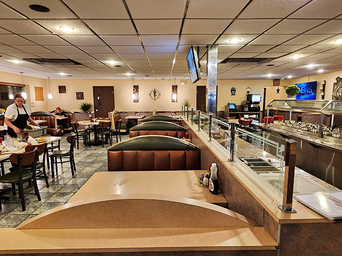 The dining room buzzes with conversation, where strangers become friends over shared plates of comfort food.