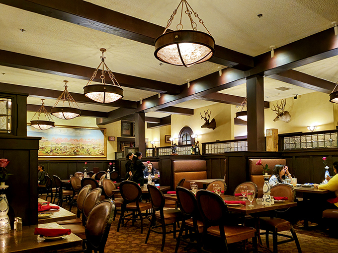 The dining room balances Western ruggedness with unexpected elegance. Those pendant lights have witnessed countless celebrations and first dates.