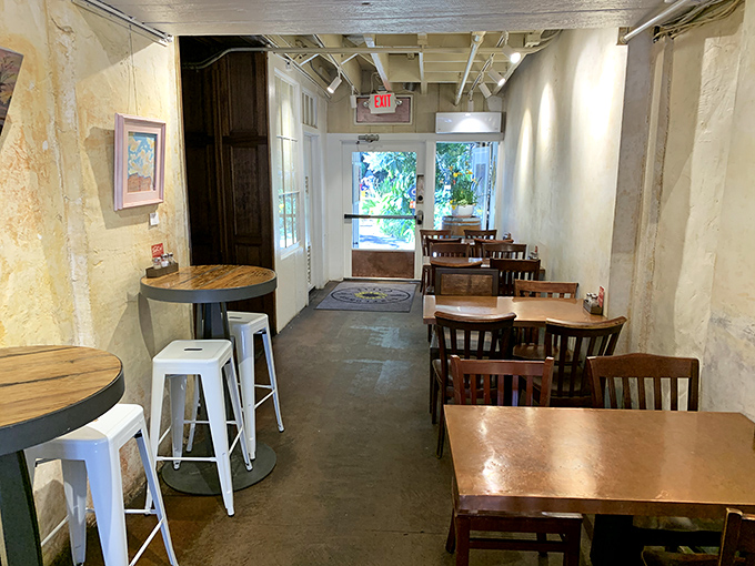 The dining area feels like that cool friend's apartment&mdash;minimalist yet inviting. Wooden tables, concrete floors, and walls that let the food be the star.