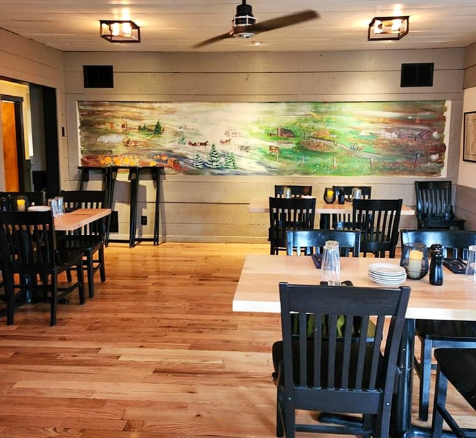 The dining room where conversations flow as easily as the drinks. That mural isn't just decoration&mdash;it's a conversation starter between bites.