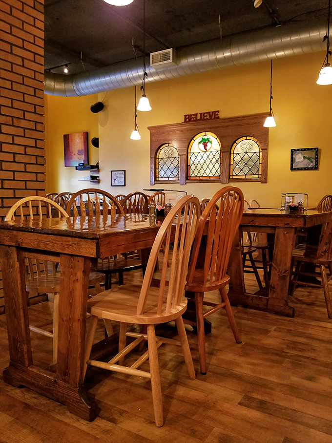 The dining area's stained glass windows and rustic wooden tables create an atmosphere where time slows down and meals become memories.