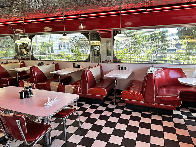 Classic black and white checkered floors meet cherry-red booths in a dining room straight from American Graffiti. Just add milkshakes and teenage dreams.