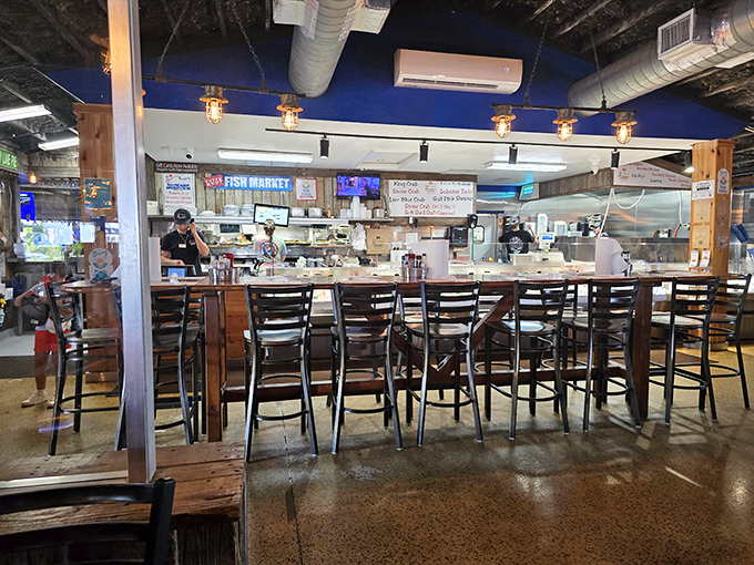 The fish market counter offers front-row seats to culinary transparency. Watch your dinner being prepped while sipping something cold.