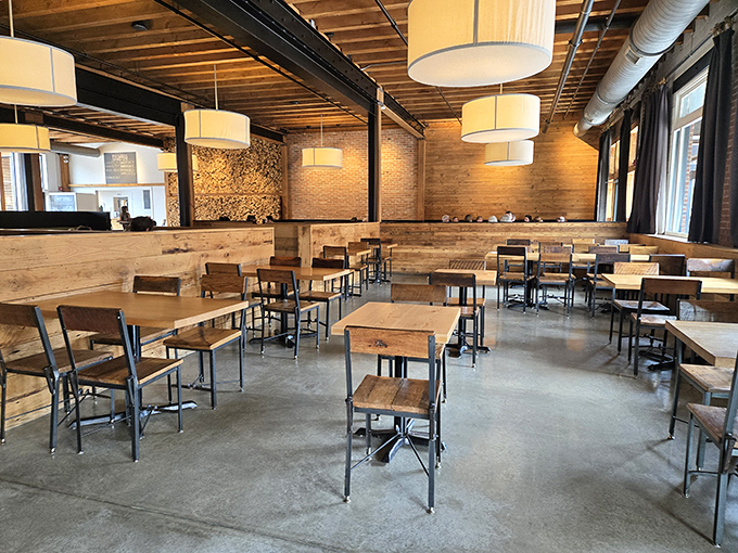 The dining room's warm wood tones and industrial touches create the perfect backdrop for memorable meals.