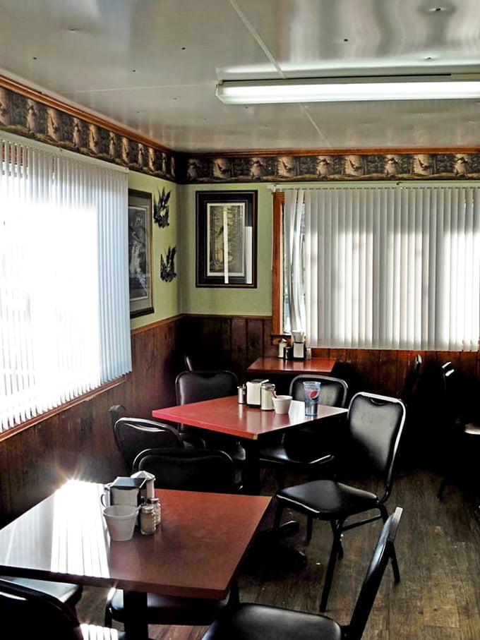 Wood paneling, green walls, and a borderline obsession with comfort&mdash;this dining area hasn't changed because it doesn't need to.