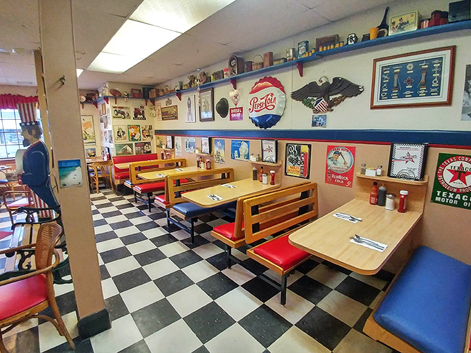 A retro dining area with checkerboard floors and nostalgic decor &ndash; where every booth feels like a time machine to simpler days.