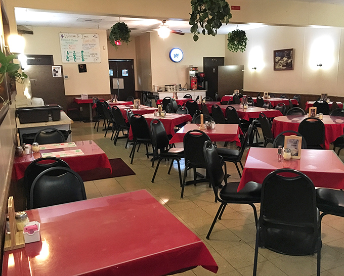 Red tablecloths and simple chairs create the perfect stage for the real stars of Inky's show: the generations of families making memories over meals.