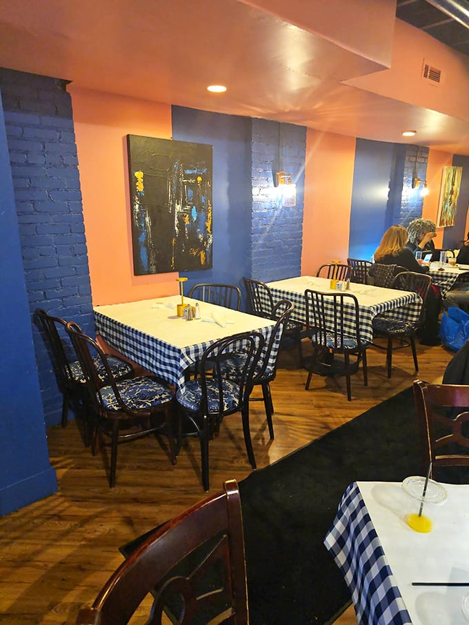 Blue walls and black-and-white checkered tablecloths create the perfect canvas for the real artwork that arrives on your plate.