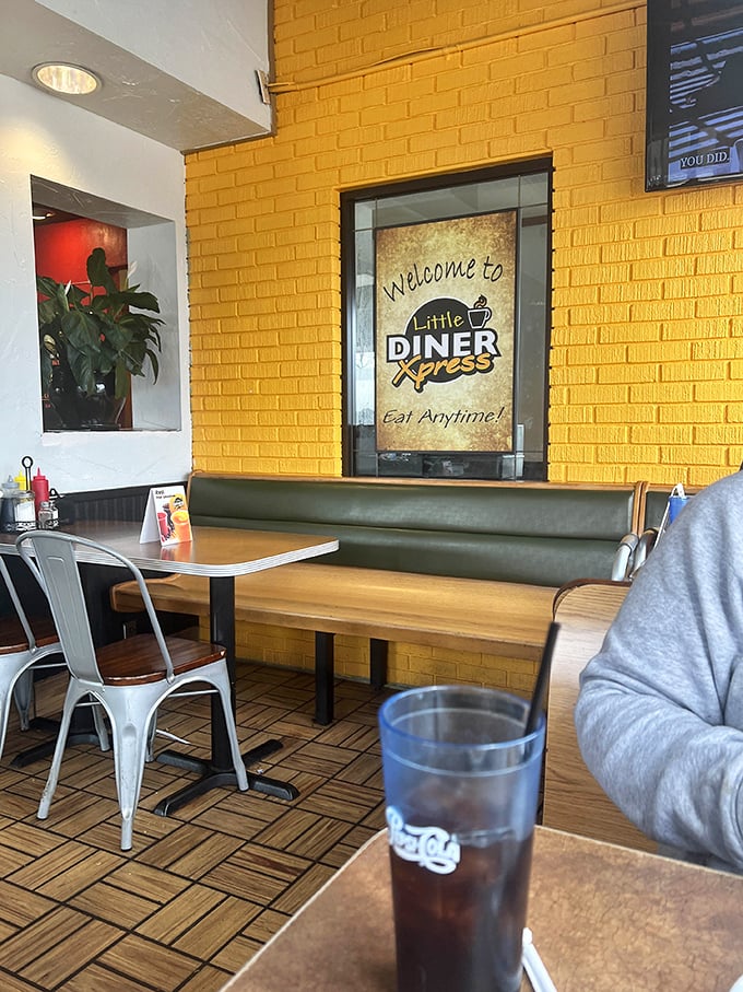 Bright yellow brick walls and cozy booths create the perfect backdrop for memorable breakfast conversations.