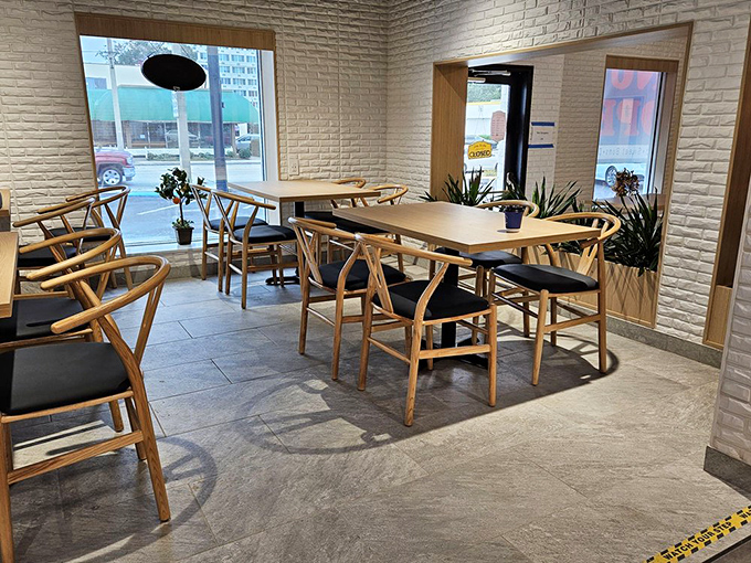 The dining area combines minimalist chic with warm wood tones&mdash;like if Scandinavian design and Asian hospitality had a particularly attractive baby.