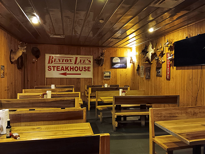 Wooden booths worn smooth by decades of happy diners create an atmosphere where conversations flow as freely as the sweet tea.