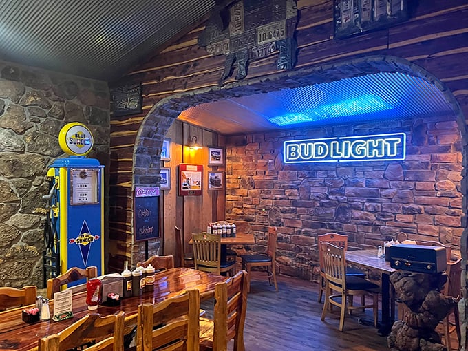Stone walls and neon signs create the perfect backdrop for barbecue consumption. Like dining in a rustic cabin with modern comforts.