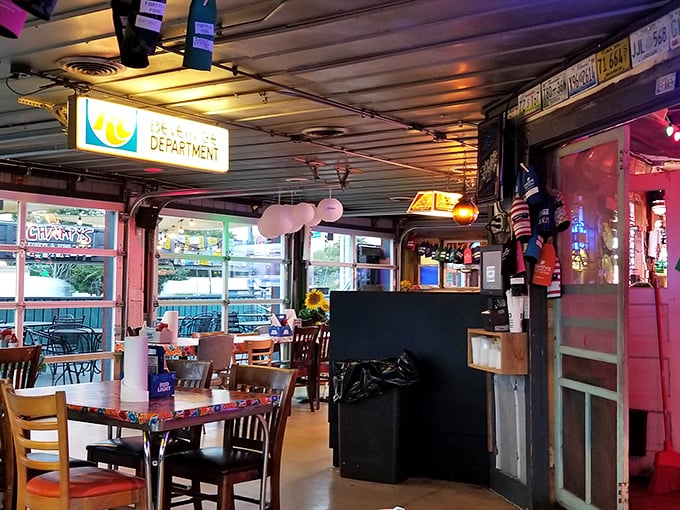 The dining area feels like the coolest friend's garage that's been transformed into the ultimate hangout spot. License plates and memorabilia tell stories.