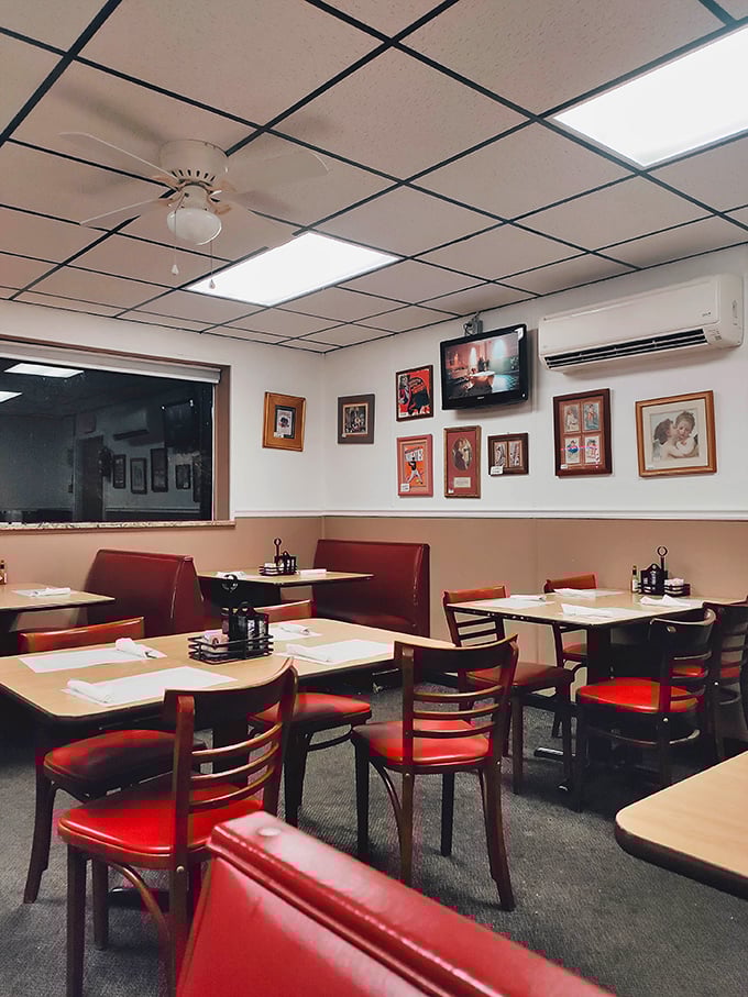 Red booths and framed memories create the perfect backdrop for your breakfast adventure story.