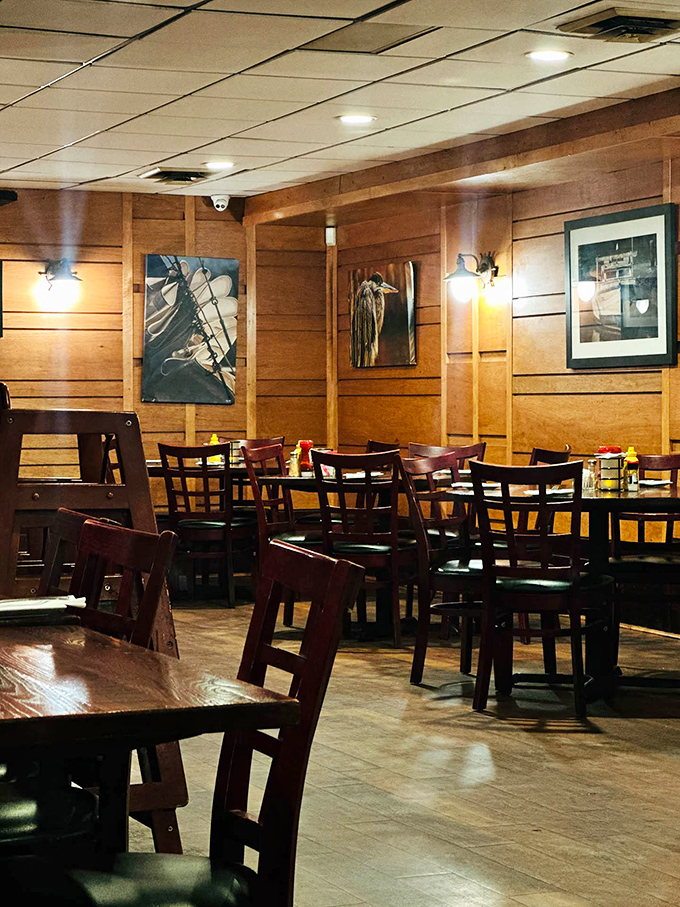 The dining room's wood-paneled charm feels like stepping into a maritime captain's quarters, if that captain had excellent taste in comfort food.