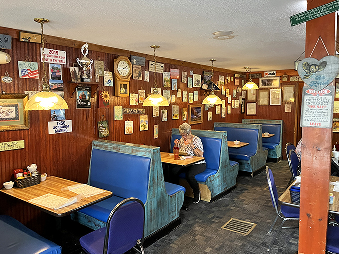 Blue vinyl booths worn to a perfect patina by generations of diners, under walls that tell stories if you know how to listen.