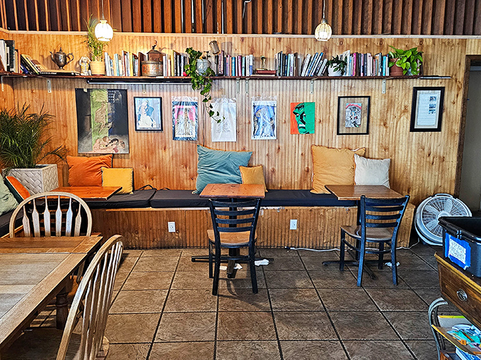The cafe's reading nook, where wooden benches, colorful pillows, and well-thumbed books invite you to linger long after your plate is empty.