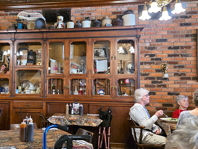 Vintage cabinets filled with curiosities create a homey backdrop that makes every meal feel like Sunday dinner at grandma's&mdash;if grandma smoked meat.