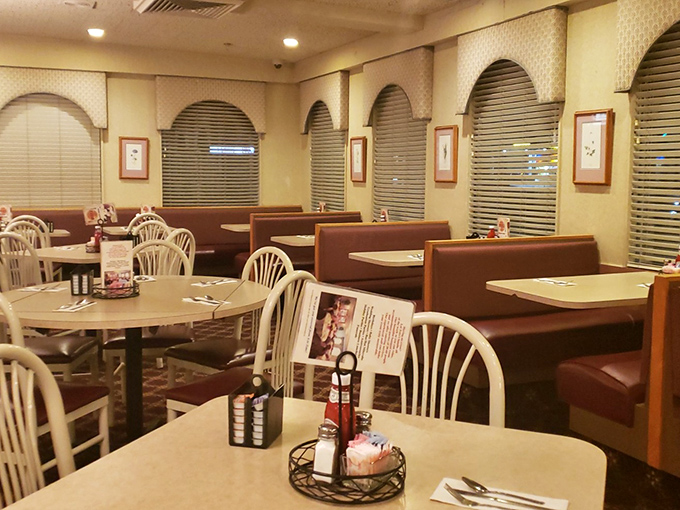The dining area waits patiently between rushes, like a theater between performances &ndash; each booth ready to host the next culinary experience.