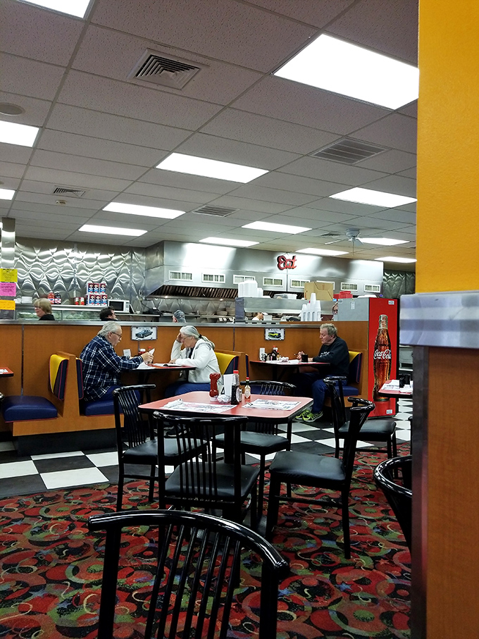 The dining area hums with conversation and the promise of comfort food. These booths have heard decades of local gossip.
