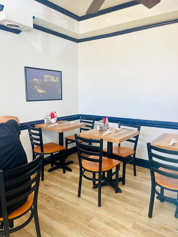 The dining area's blue trim and wooden tables create that rare space where both hipsters and retirees feel equally at home.