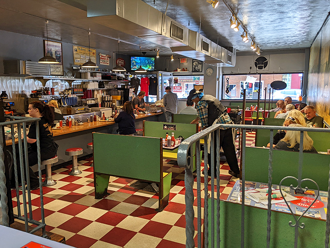 The classic checkered floor and green booths aren't retro by design&mdash;they're authentic by survival, hosting decades of Pittsburgh breakfast stories.