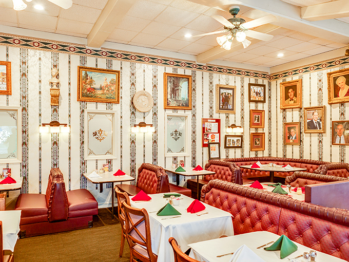 The dining room walls tell stories through framed memories, while red booths invite you to create your own over plates of pasta and bottles of wine.