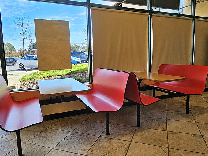 Red bench seating that says, "Stay awhile, but not too long." The perfect backdrop for the main character of your morning: the donut.