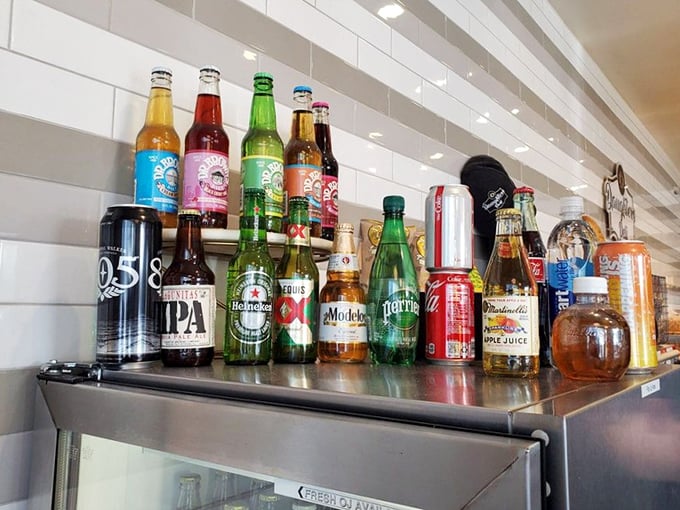 Classic sodas and modern beverages peacefully coexisting - like a delicious United Nations of refreshment.