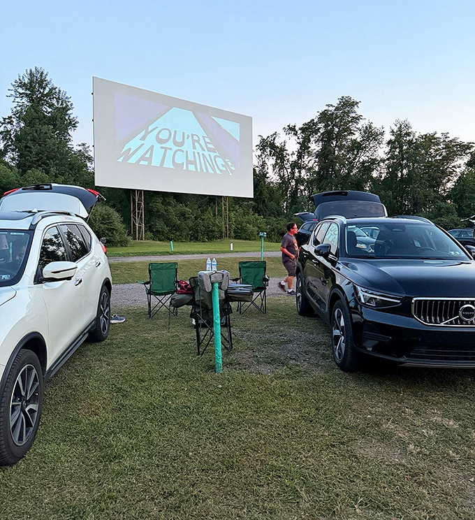 "You're watching..." And indeed we are, from the comfort of lawn chairs and SUVs, as twilight sets the perfect scene.