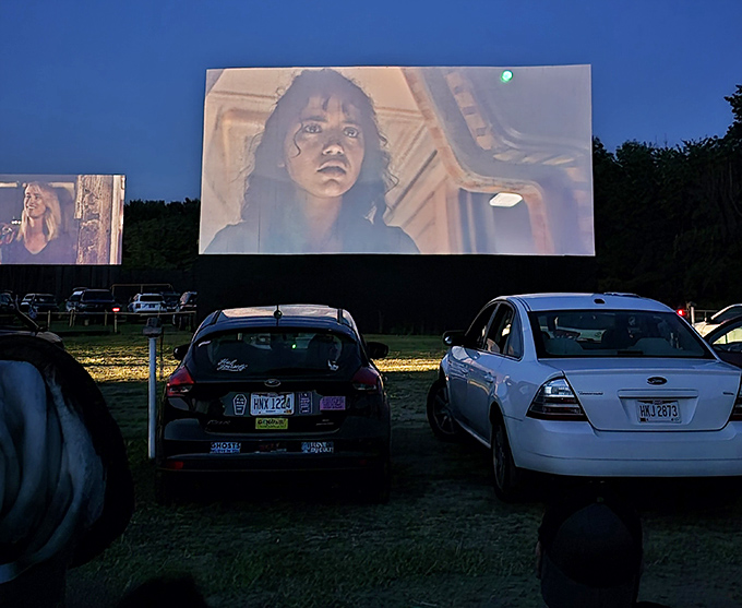 When darkness falls, the screen illuminates with cinematic magic, transforming ordinary cars into private viewing lounges under the stars.