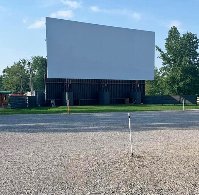 The blank canvas awaits its story in the daylight. That massive screen has witnessed thousands of first dates, family outings, and summer memories.