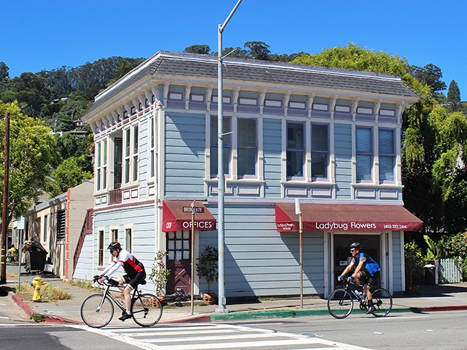 Cyclists glide past Ladybug Flowers, embodying Sausalito's perfect marriage of exercise and aesthetics. Even errands feel like a vacation in this postcard-perfect town.