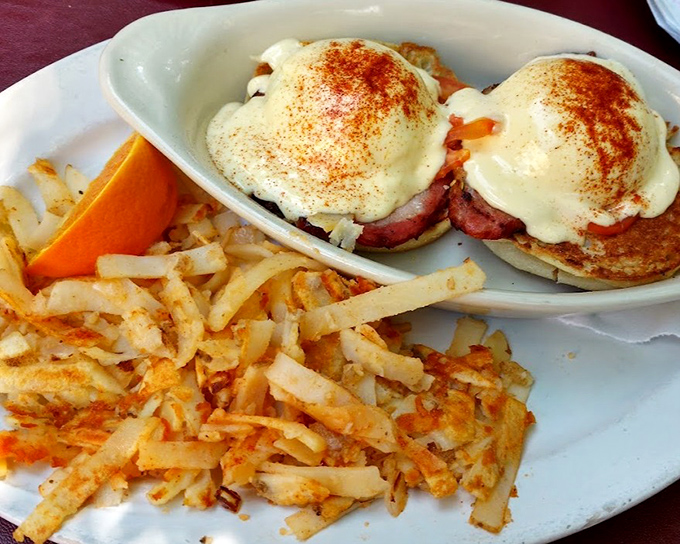 Eggs Benedict that would make a brunch enthusiast weep with joy. Those hash browns aren't just crispy—they're achieving potato perfection.