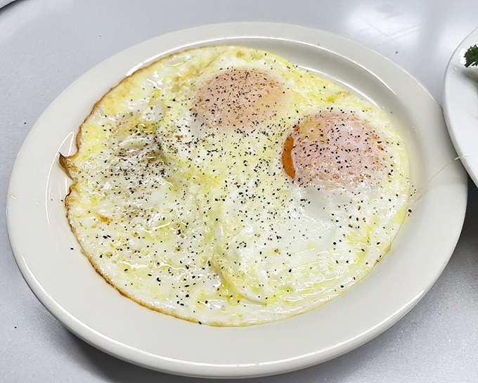 Two sunny-side up eggs staring back at you like old friends saying, "Good morning! We promise to make your day better."