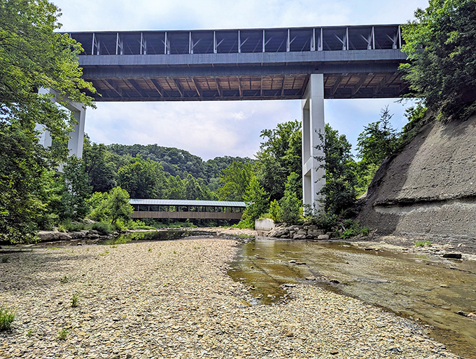 Two bridges, two eras, one stunning view. The modern span above seems to admire its wooden predecessor below.
