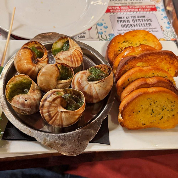 Escargot that would make a Frenchman homesick, swimming in garlic butter that demands every last drop be sopped up with that toasted bread.