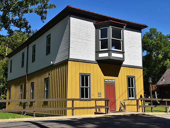 Sunshine meets history at Farley's Music Hall, its yellow and white facade a cheerful reminder of Elsah's vibrant community spirit.