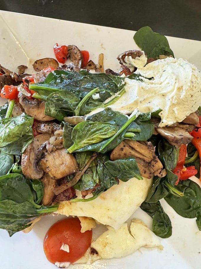 The Farm Fusion brings garden freshness to waffle form. Spinach, mushrooms, and eggs prove vegetables belong at breakfast too.